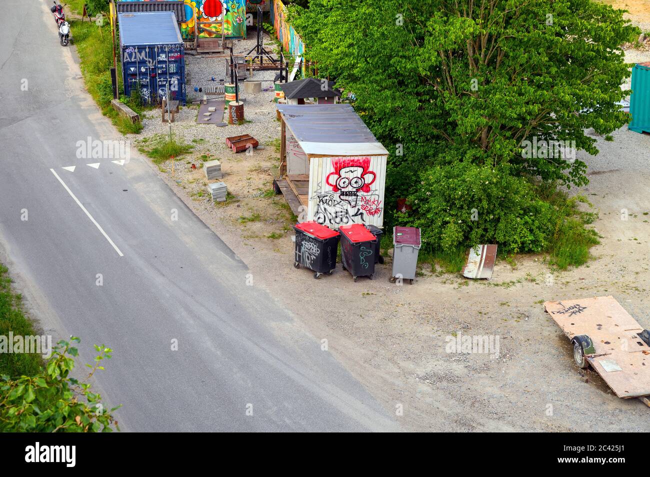 View of an area with a container, a shed and some trash cans in Aarhus ...