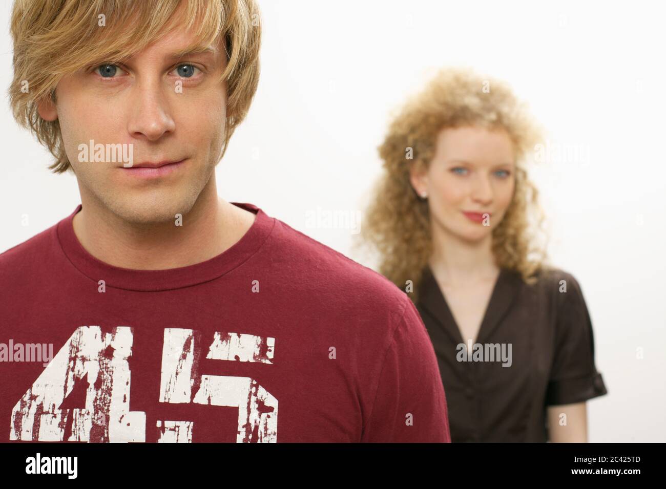 Couple standing in a row, portrait Stock Photo - Alamy