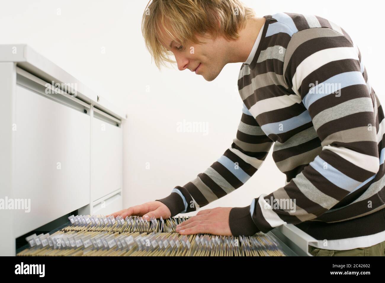 Filing cabinet man hi-res stock photography and images - Alamy