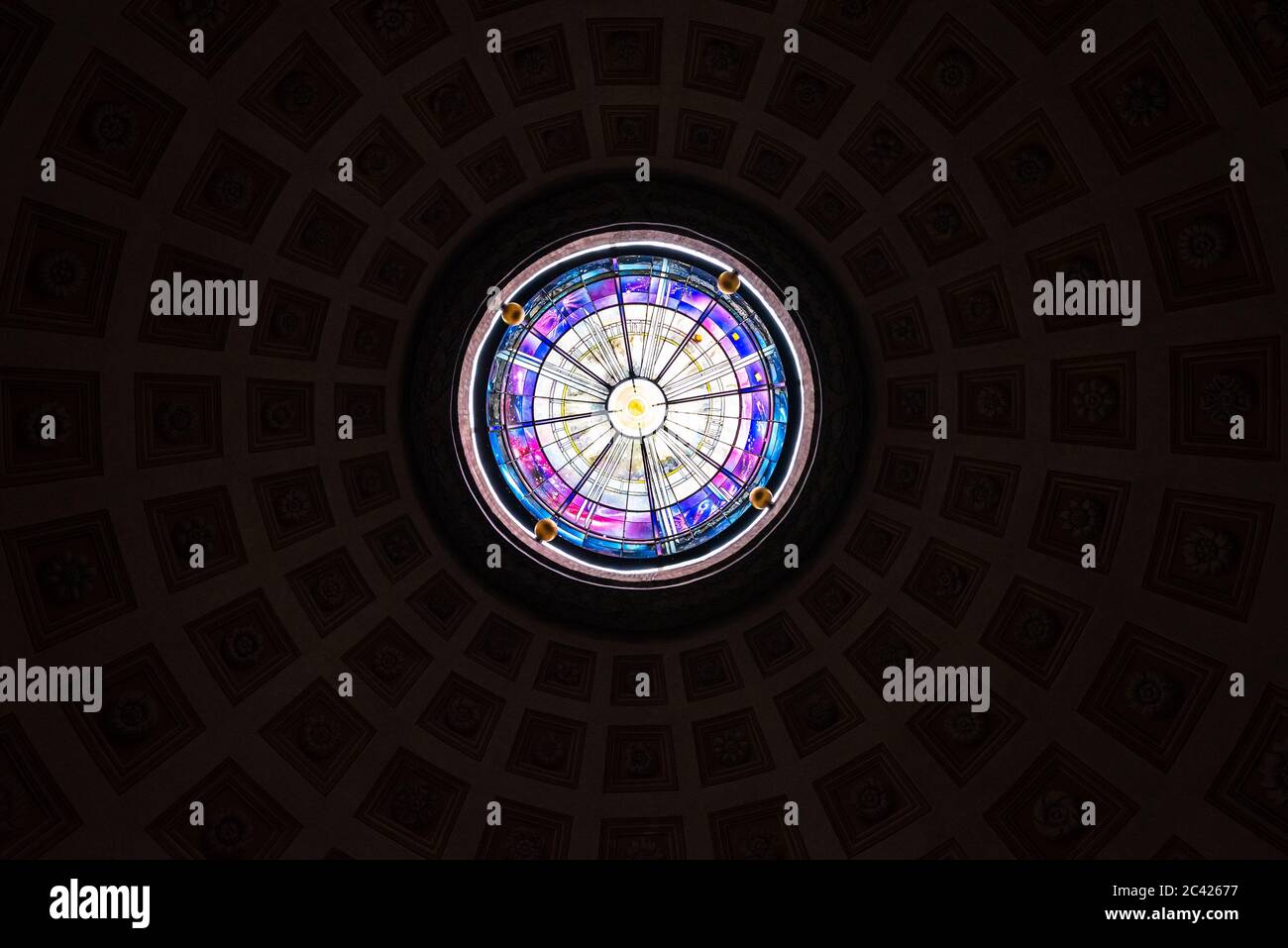 Monumental stained glass windows under the dome of a church in Rome ...