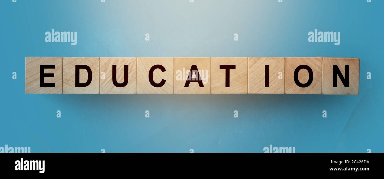 Education Word Written In Wooden Cubes in blue gradient background ...