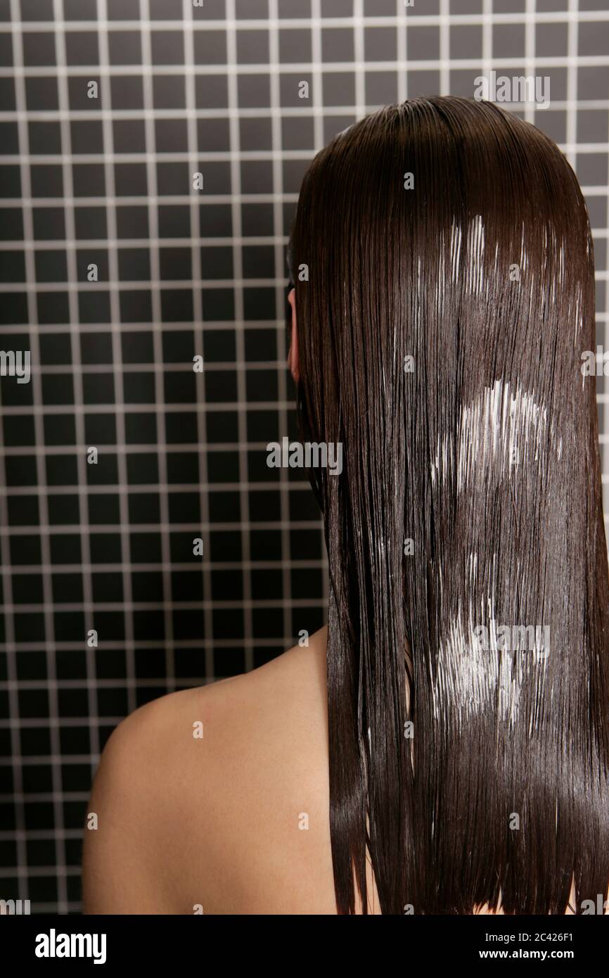 Woman from behind with shampoo in wet hair - shower - hygiene Stock ...