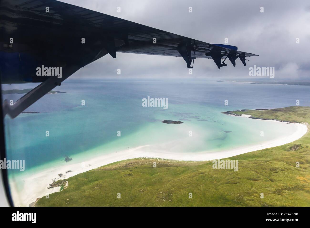The view from the airplane as it flies over the Isle of Barra, Outer ...