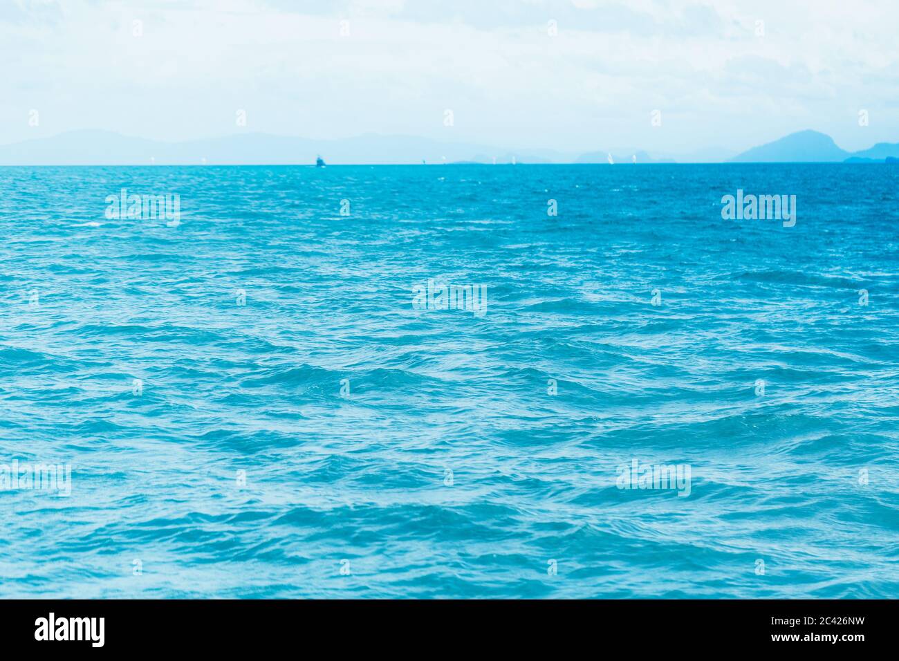 Bright Blue ocean with smooth wave background Stock Photo - Alamy