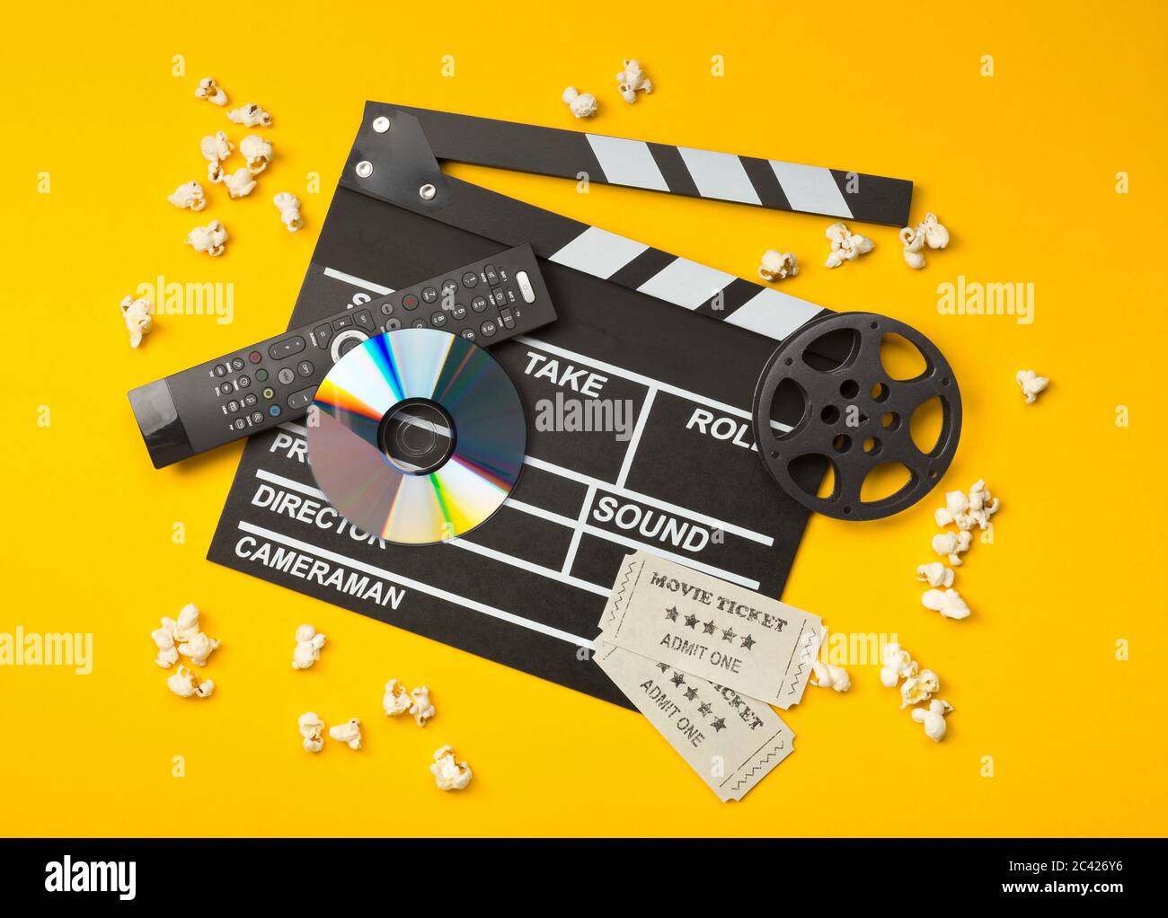 Single, black, open movie clapper or clapper-board with dvd movie disc ...
