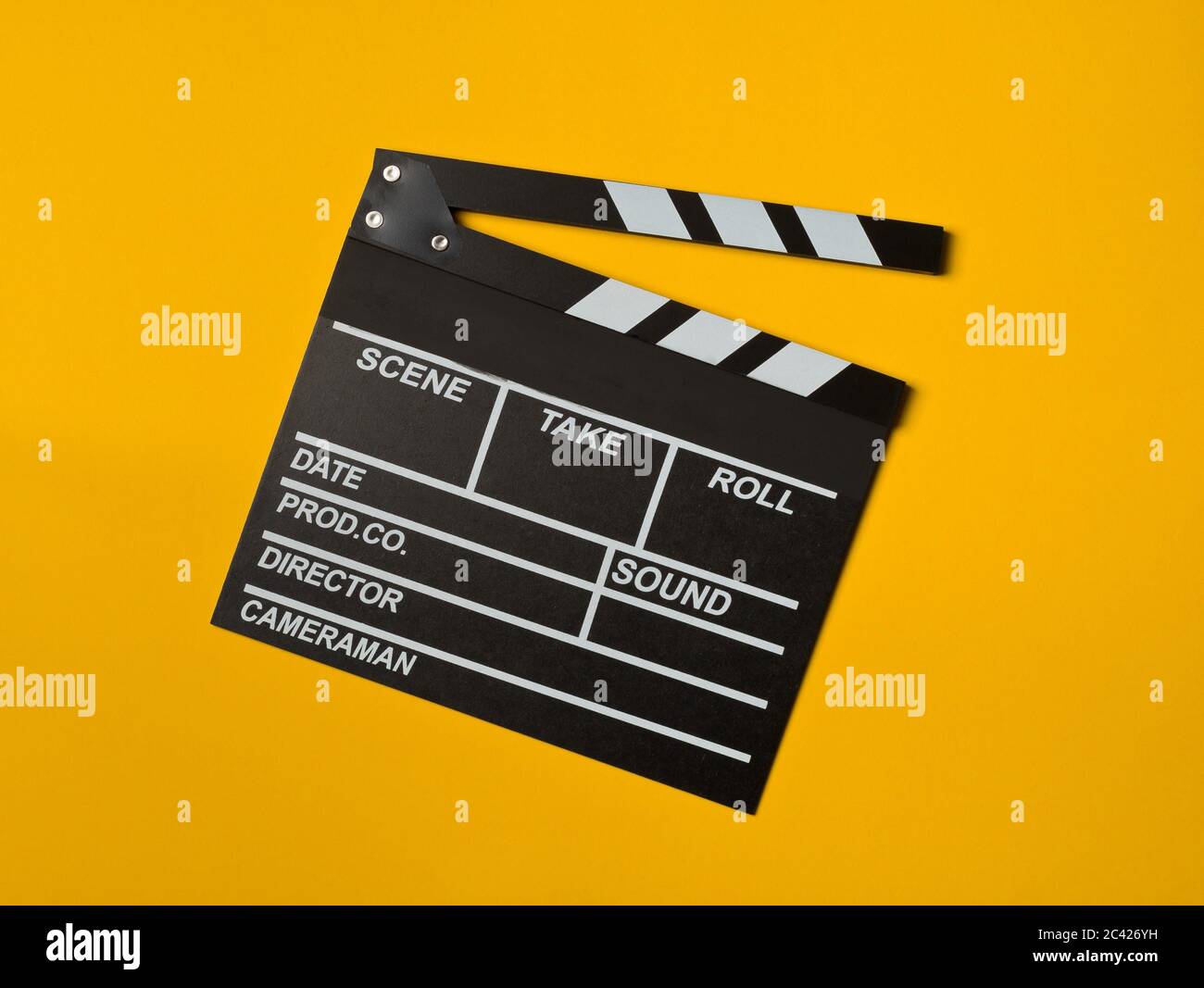 Single, black, opened movie clapper or clapper-board flat lay top down ...