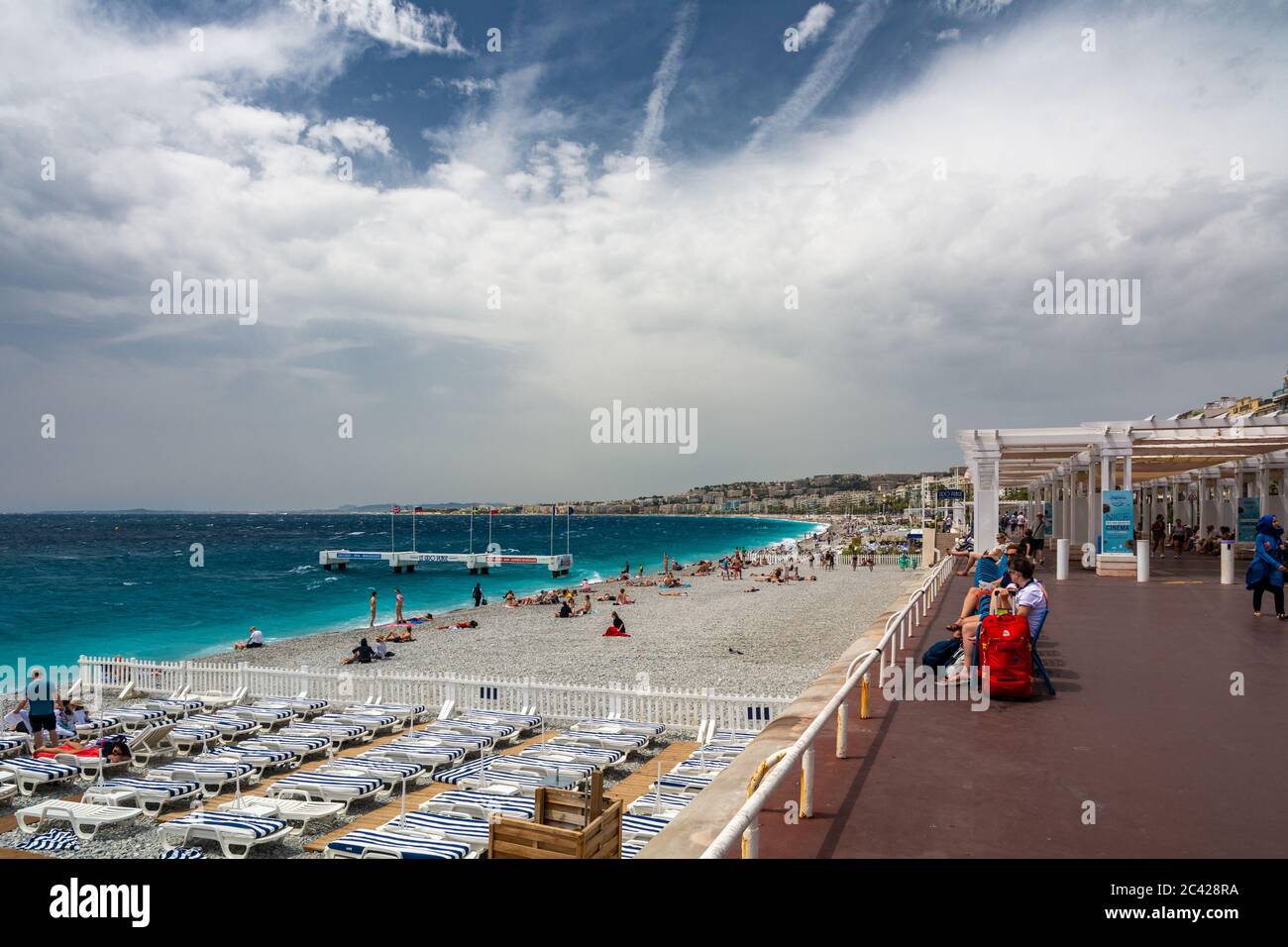 Nice, France - June 14, 2019 : Tourists enjoying their day on the beach ...