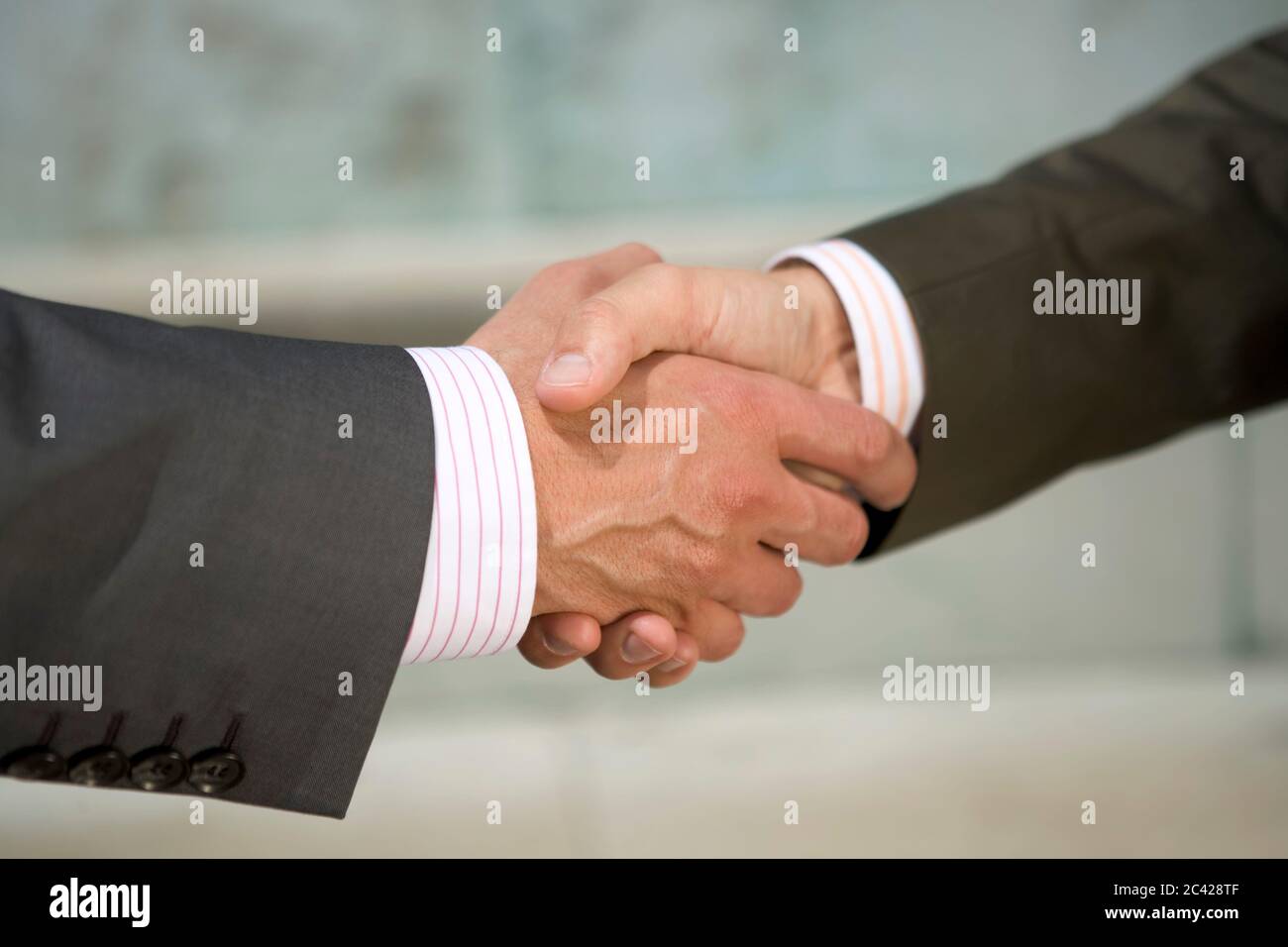 Two businessmen shake hands - gesture - farewell - agreement Stock ...