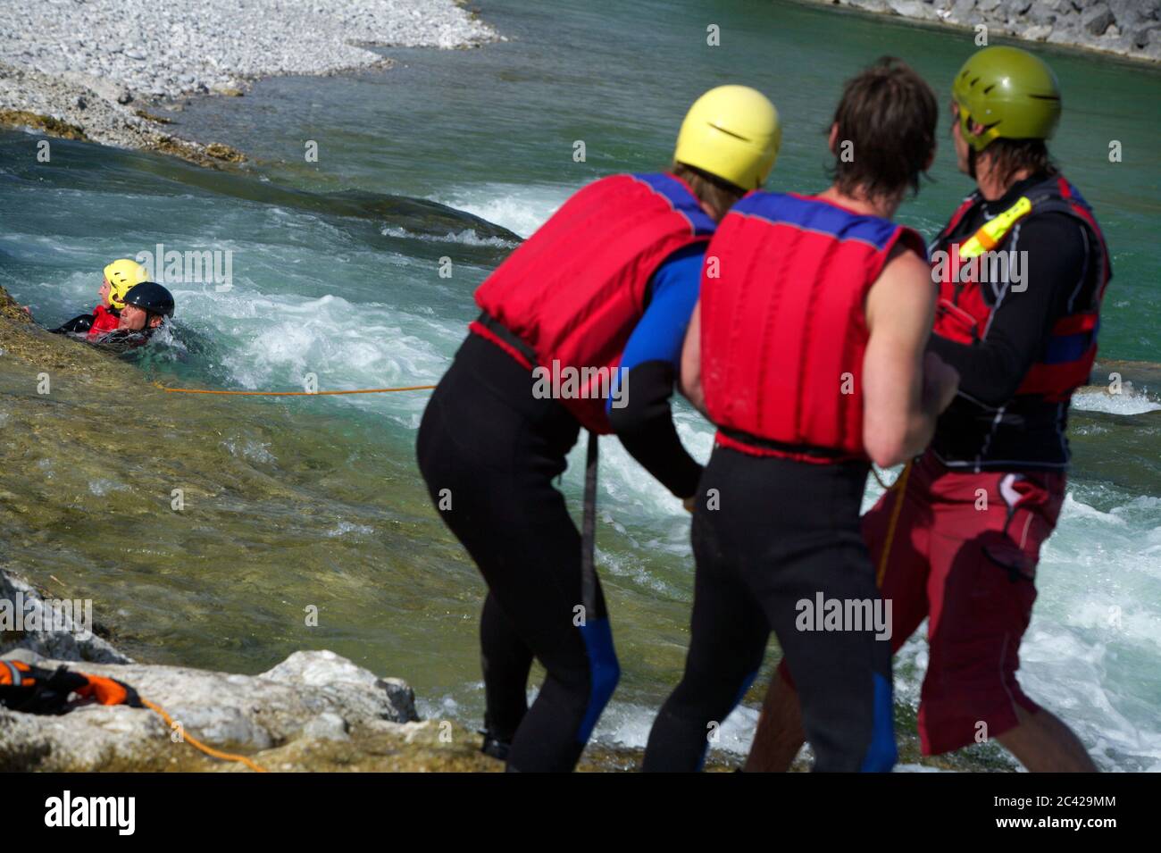 Three men pull two people out of the water - rescue - danger - white ...