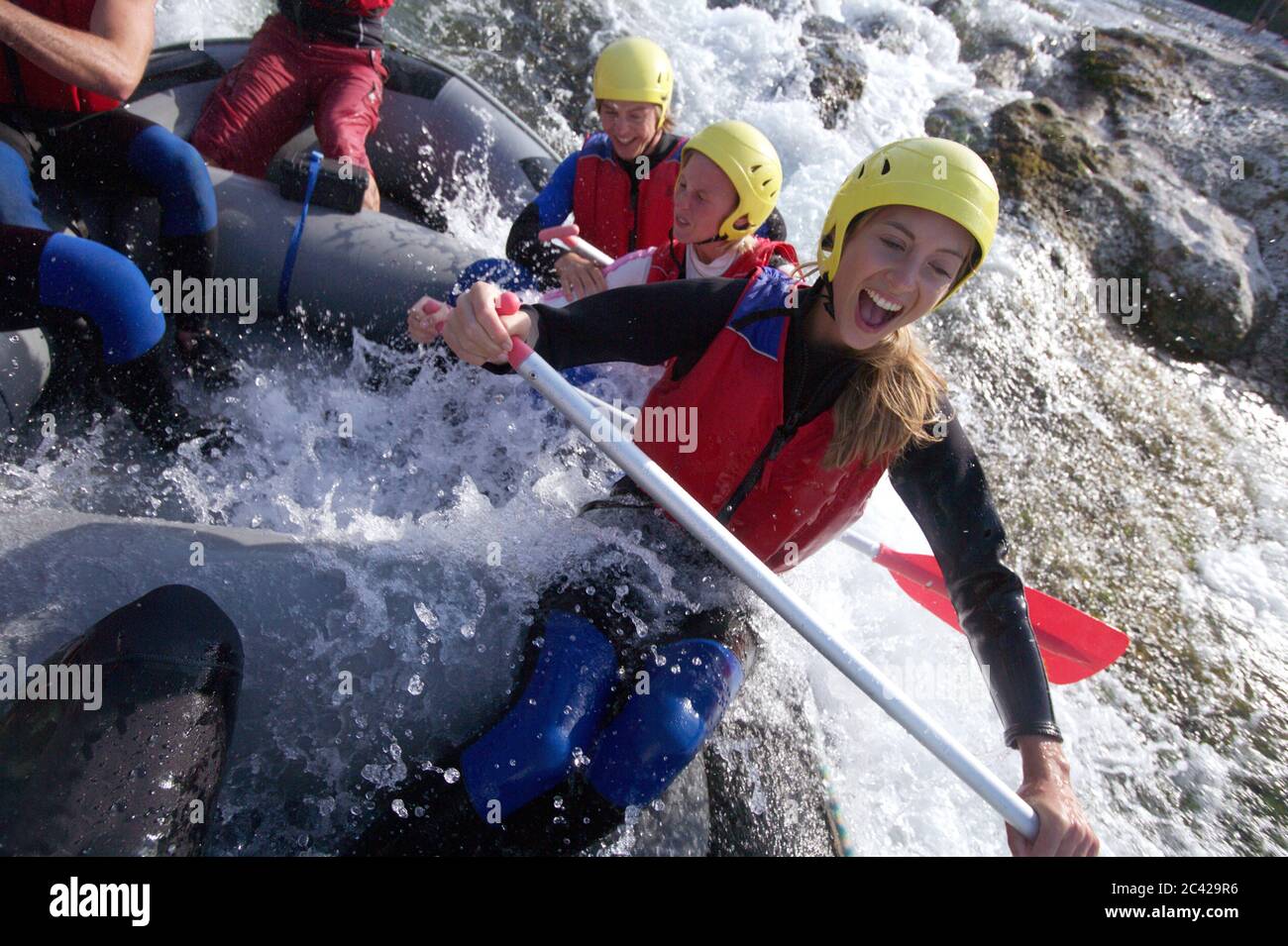 A group of five young people kayak rafting adventures Stock Photo - Alamy