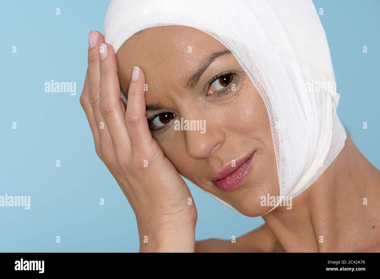 Woman with bandage around her head hi-res stock photography and images ...