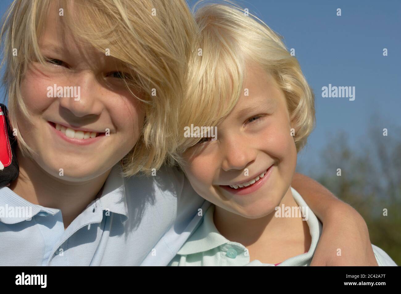 Two brothers smile at the camera Stock Photo - Alamy