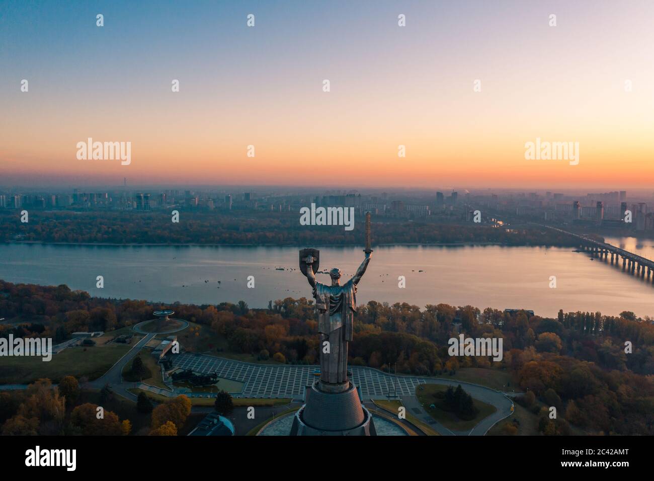 Kiev skyline over beautiful fiery sunset, Ukraine. Monument motherland ...