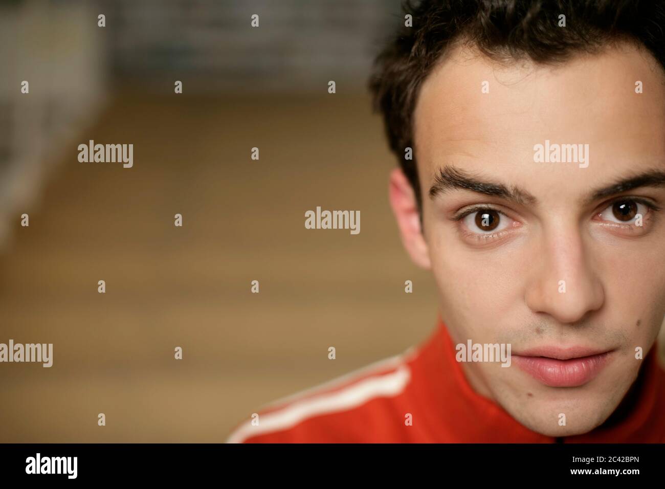 Young man looks confused at the camera - look Stock Photo - Alamy