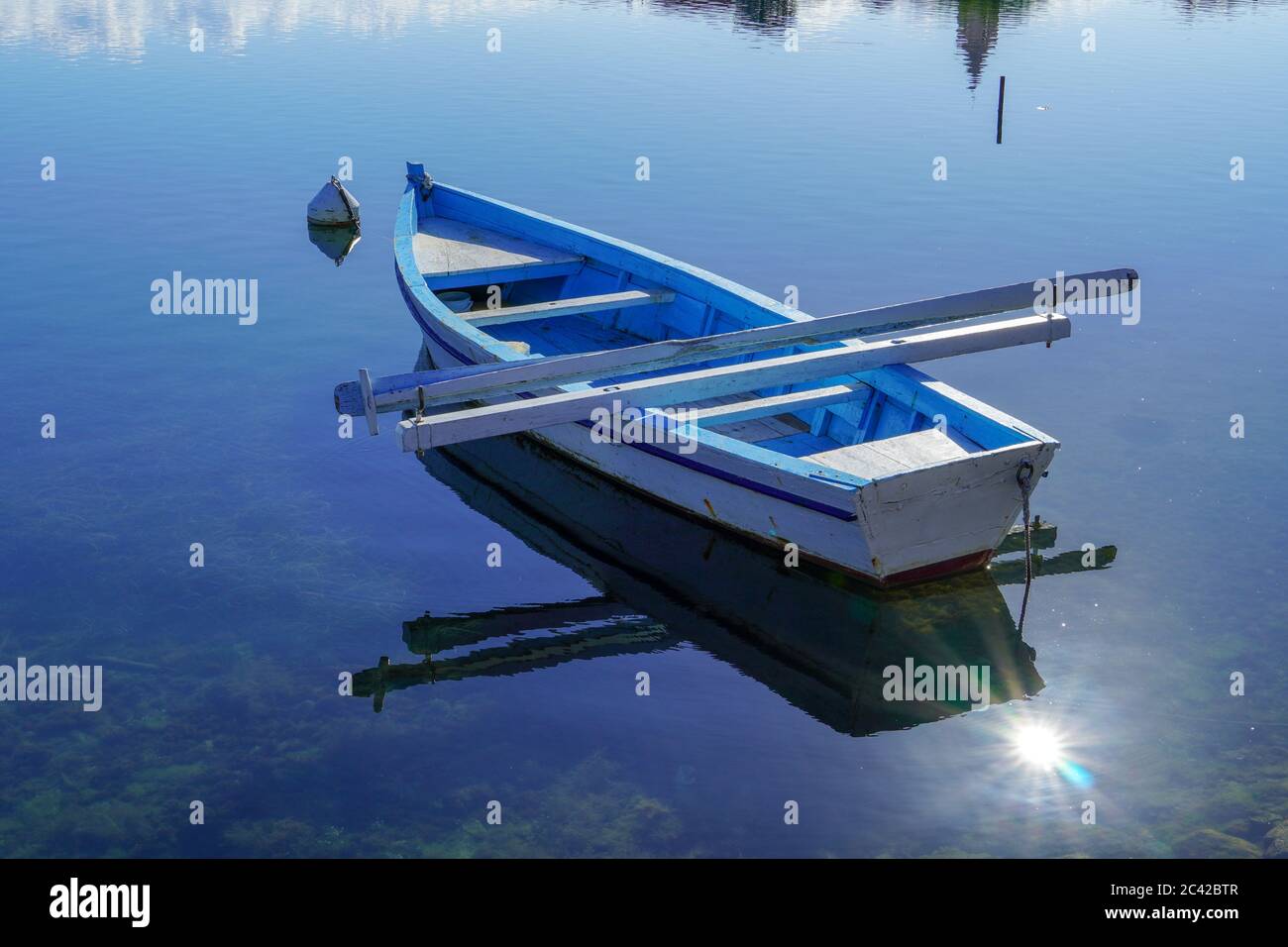 Little Blue Fishing Boat High Resolution Stock Photography and Images ...