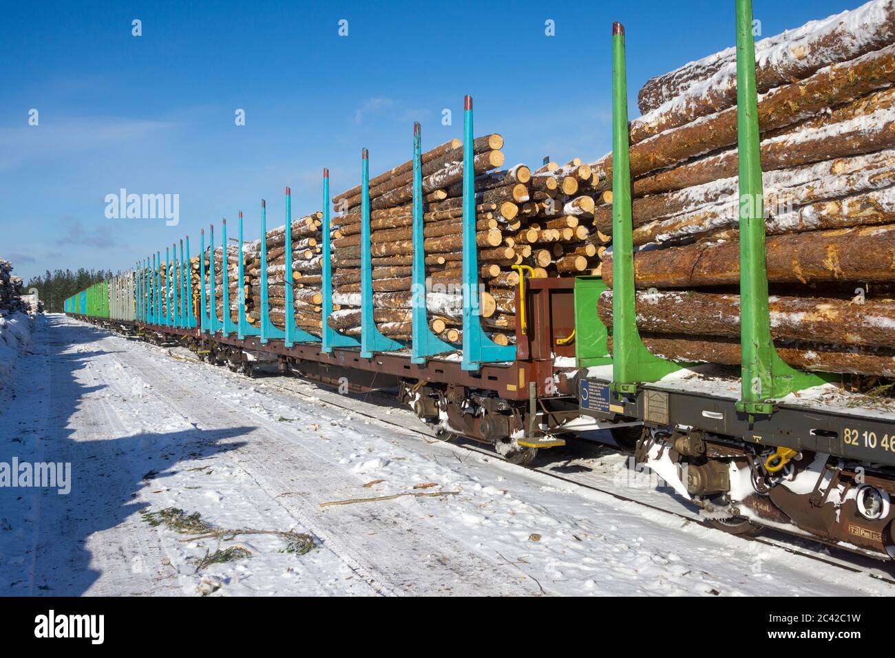 Log transport using cargo train at Winter , Finland Stock Photo - Alamy