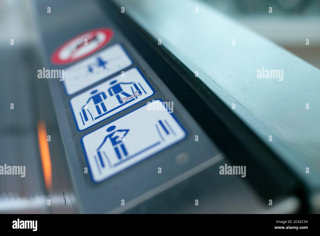 Information signs on the escalator Stock Photo - Alamy