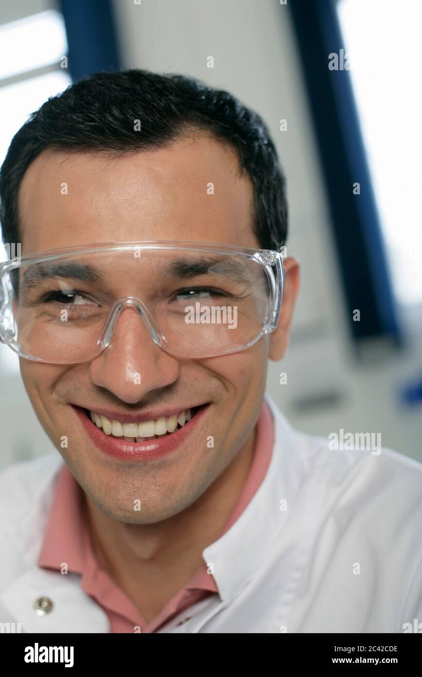 Portrait of a lab worker with safety glasses Stock Photo - Alamy