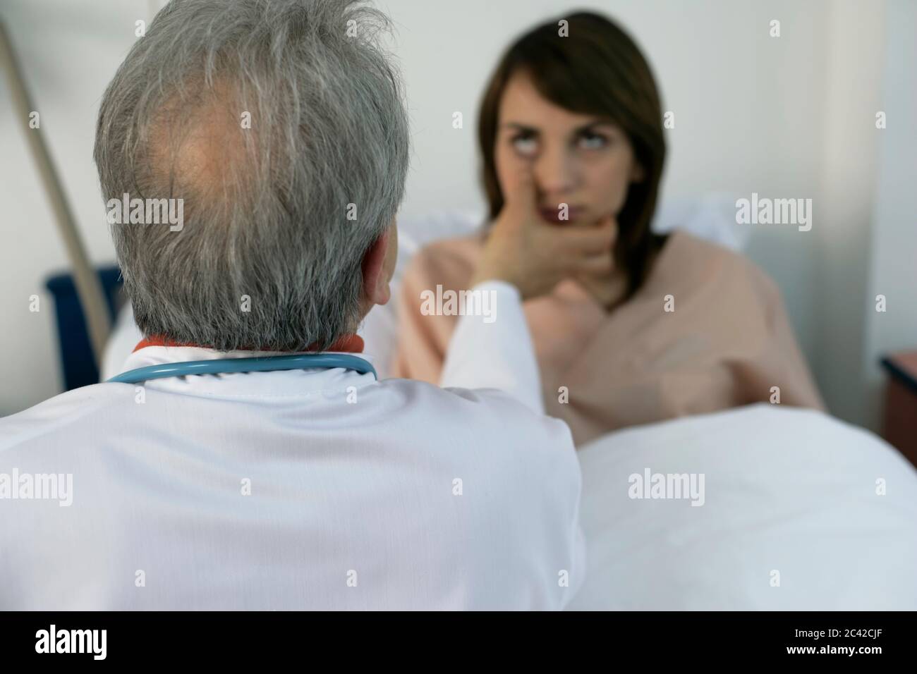 Woman pulling eye down hi-res stock photography and images - Alamy
