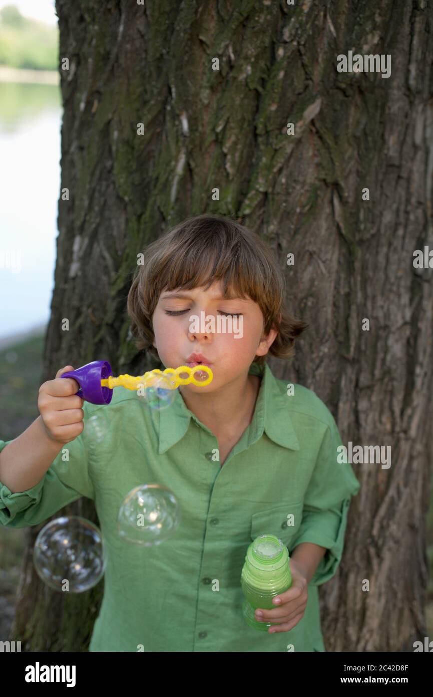 Boy makes soap bubbles hi-res stock photography and images - Alamy