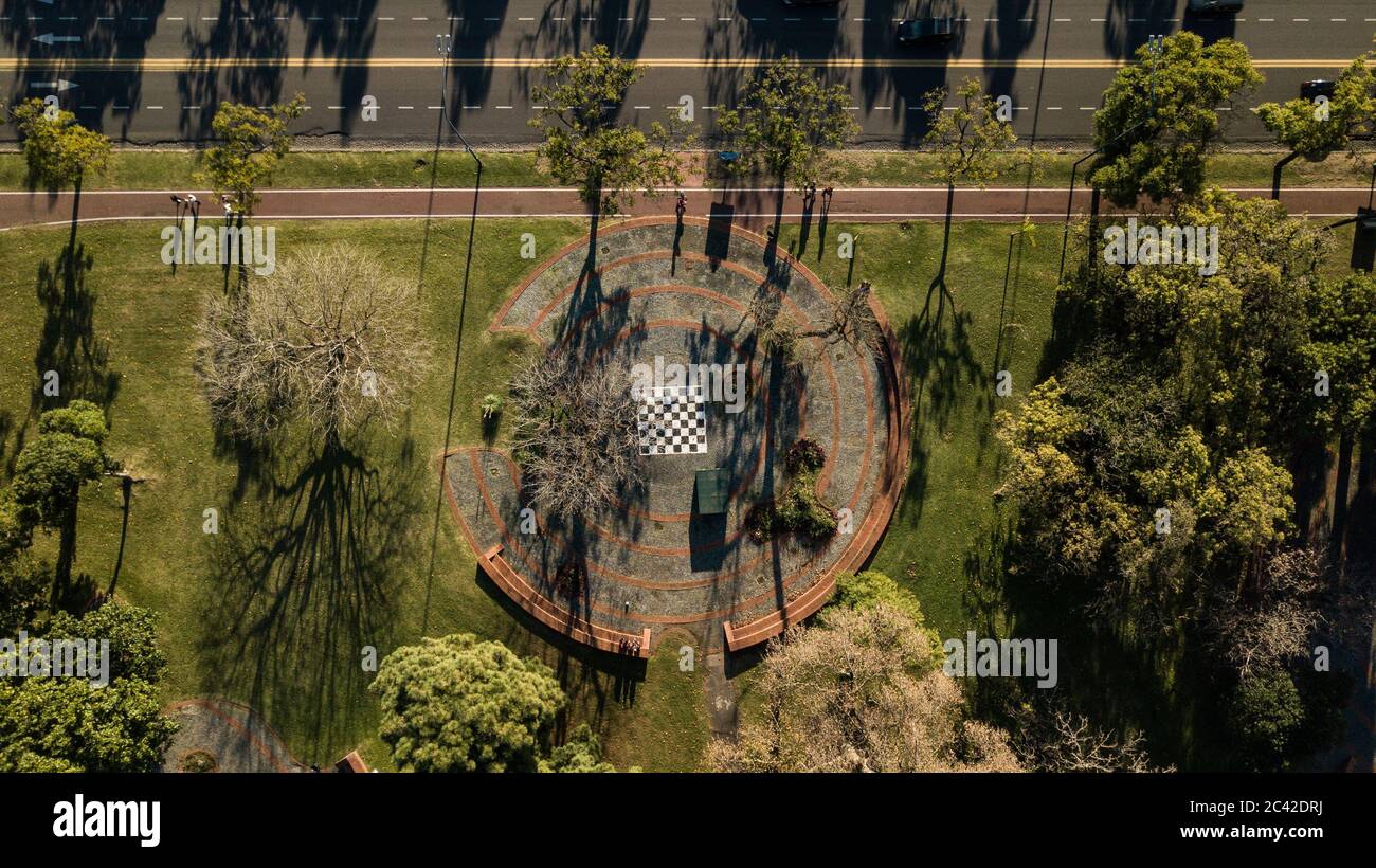 Aerial top-down view on public park with rounded plaza with human size ...