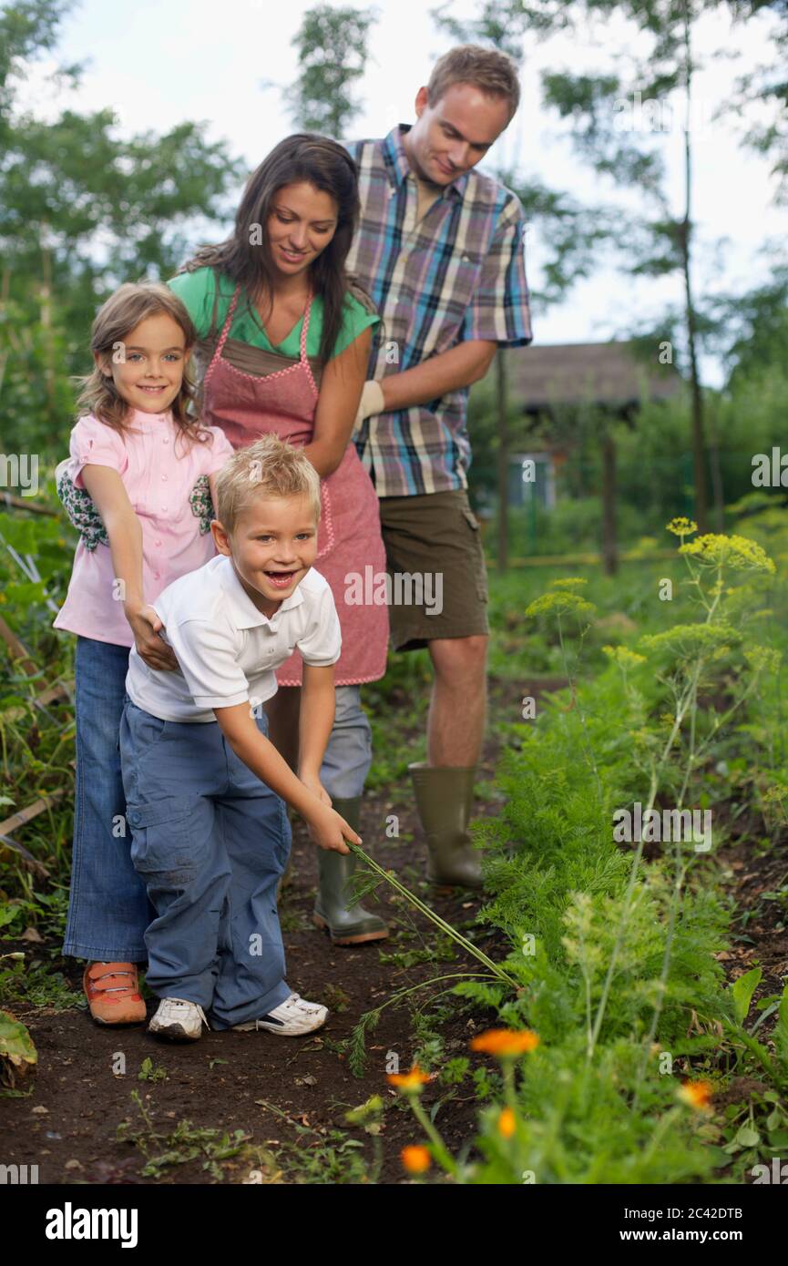 Family in the garden Stock Photo - Alamy