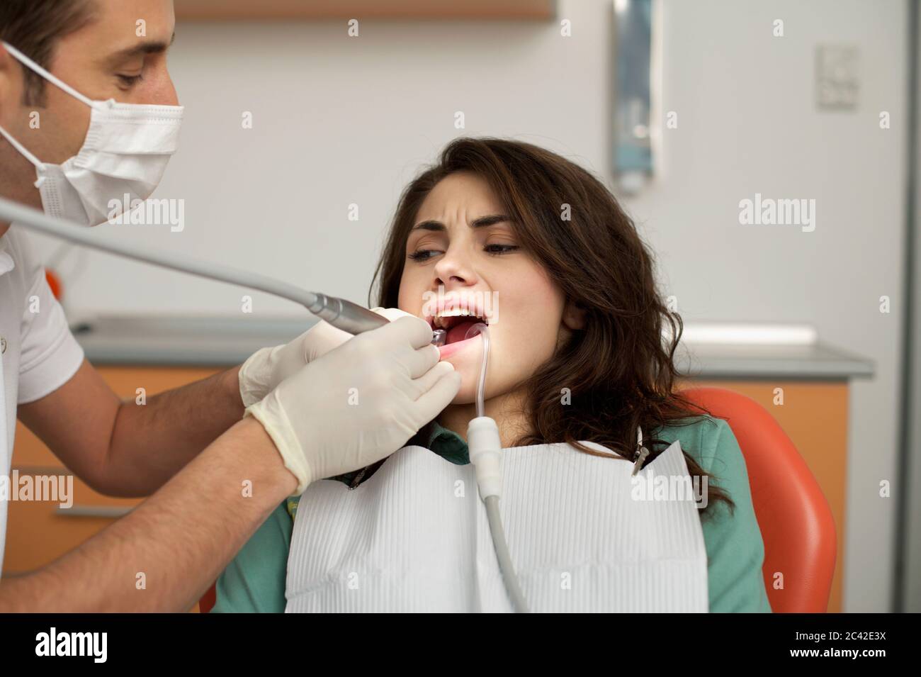 Painful dental treatment in a patient Stock Photo - Alamy