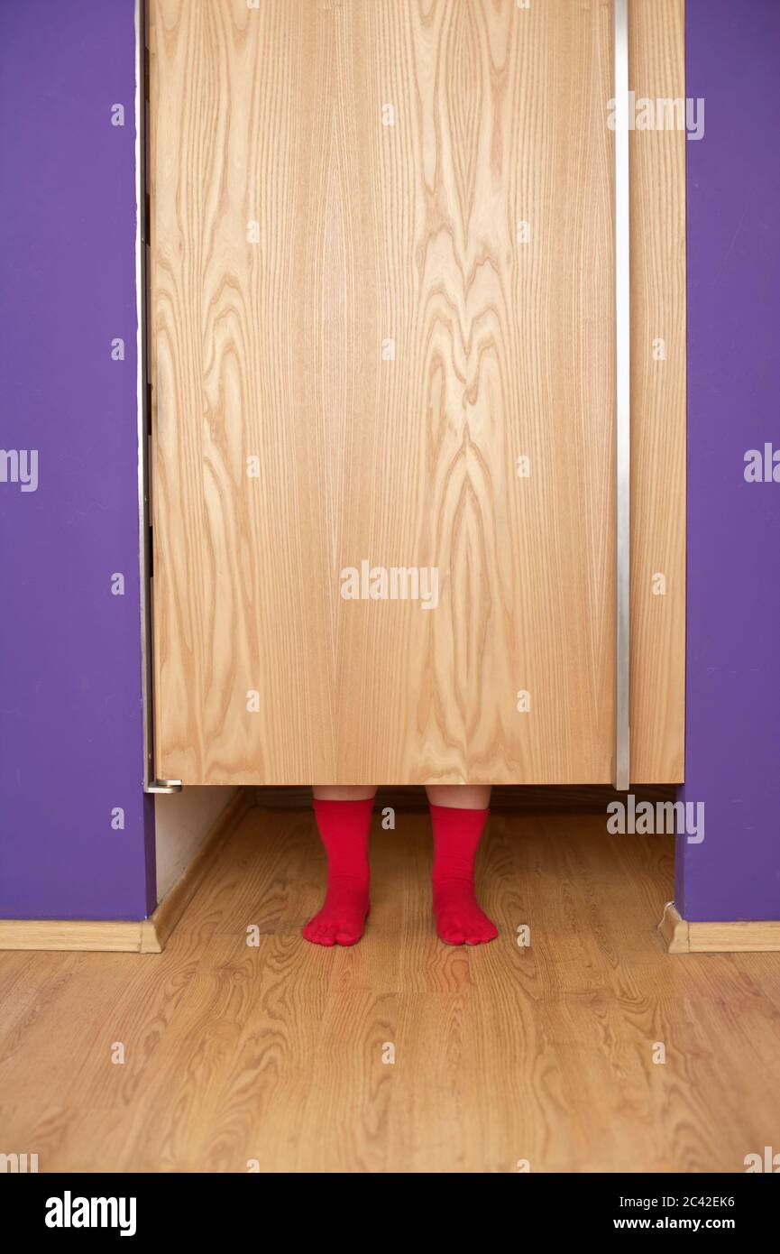 Person with red toe socks in a locker room - shame - shopping Stock ...