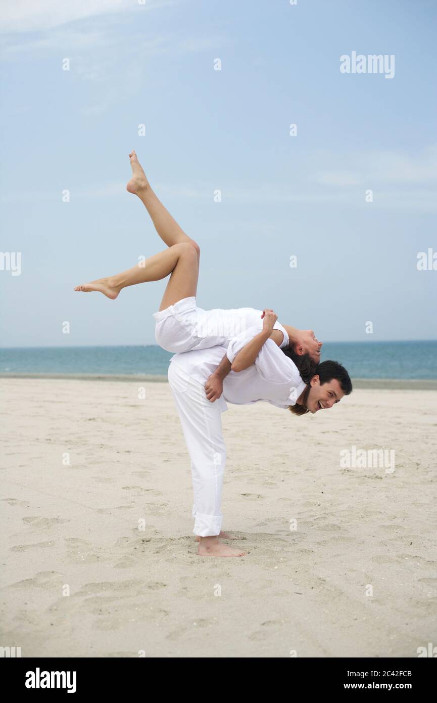 Man lifts woman hi-res stock photography and images - Alamy