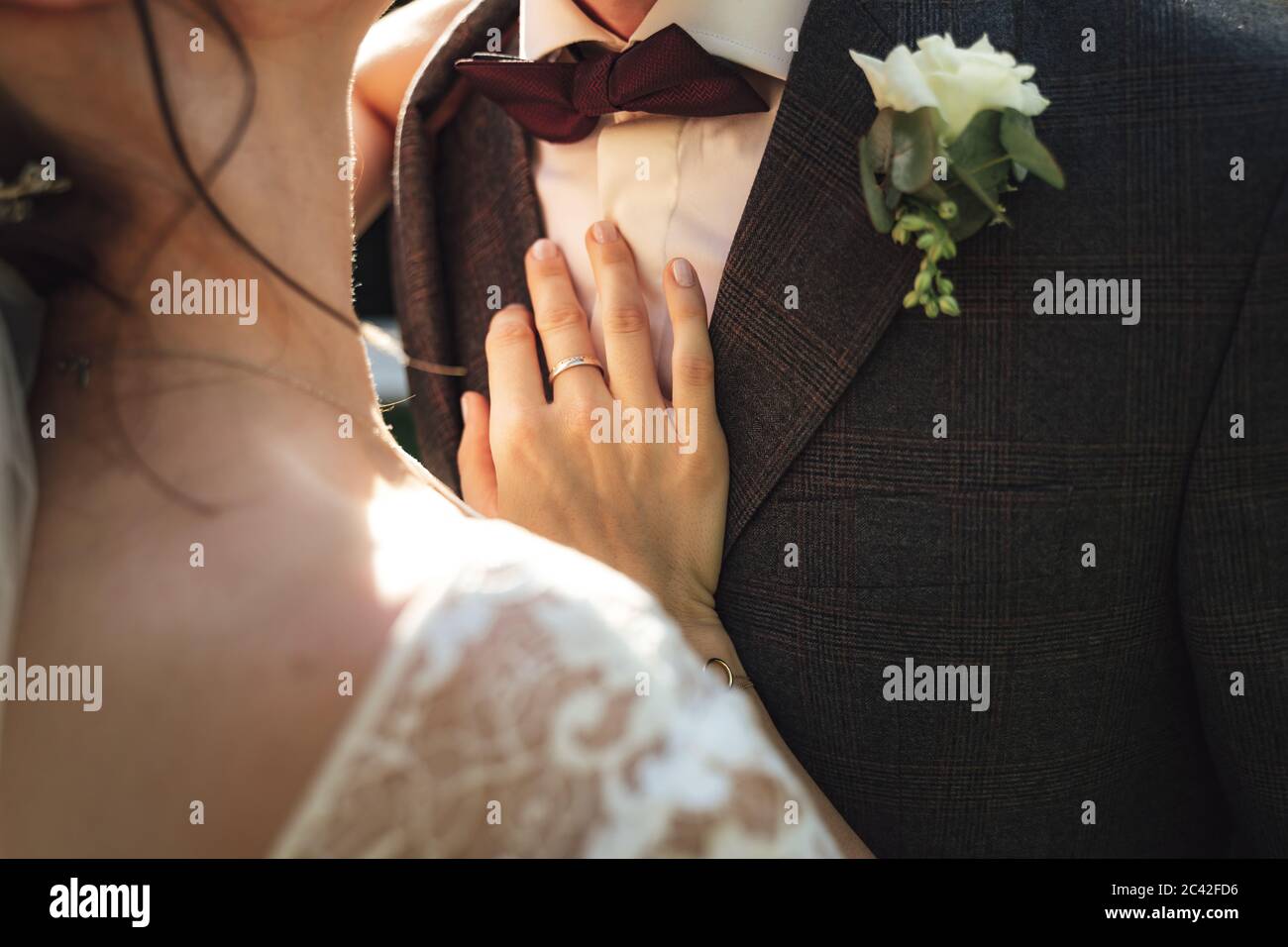 Happy couple in formal clothes. Closeup of female hand touching men's ...