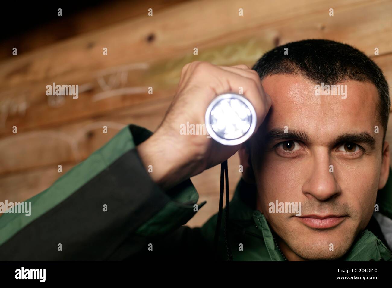 Man lights up with a flashlight Stock Photo - Alamy