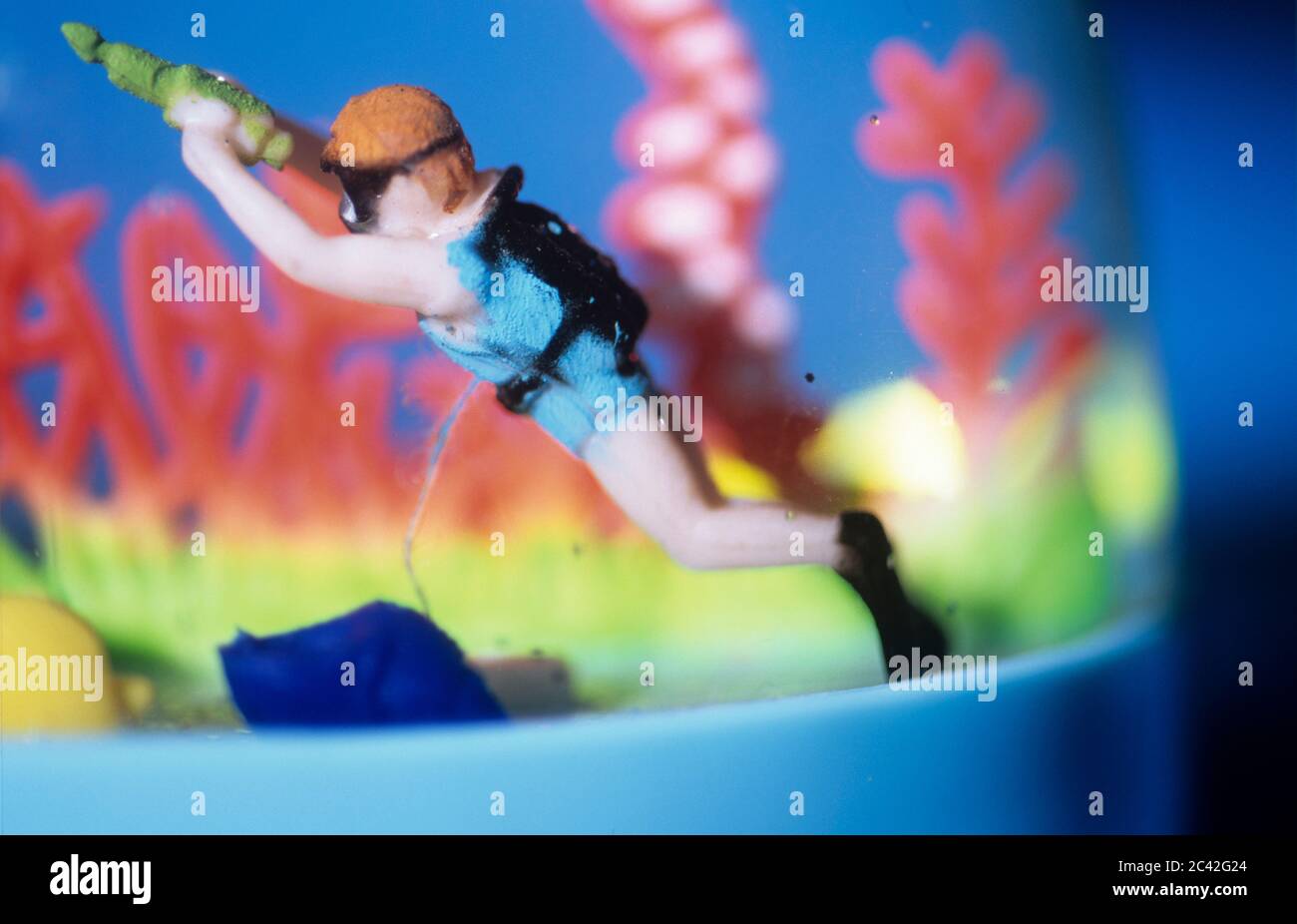 Plastic diving figure in a container filled with water - toy Stock ...