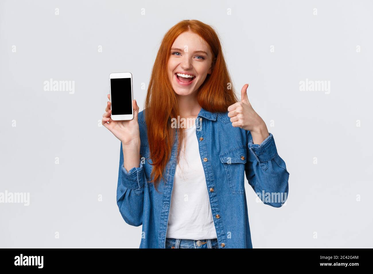 Girl Showing Friend Cool New Mobile Game Attractive Cheerful Redhead
