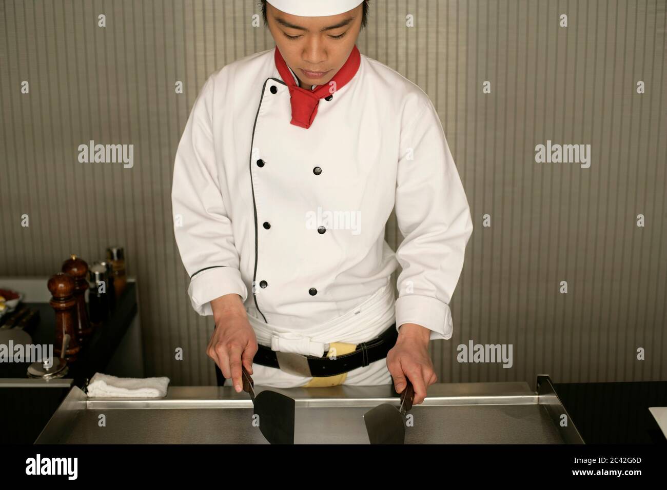 Asian cook in the kitchen - restaurant - gastronomy Stock Photo - Alamy