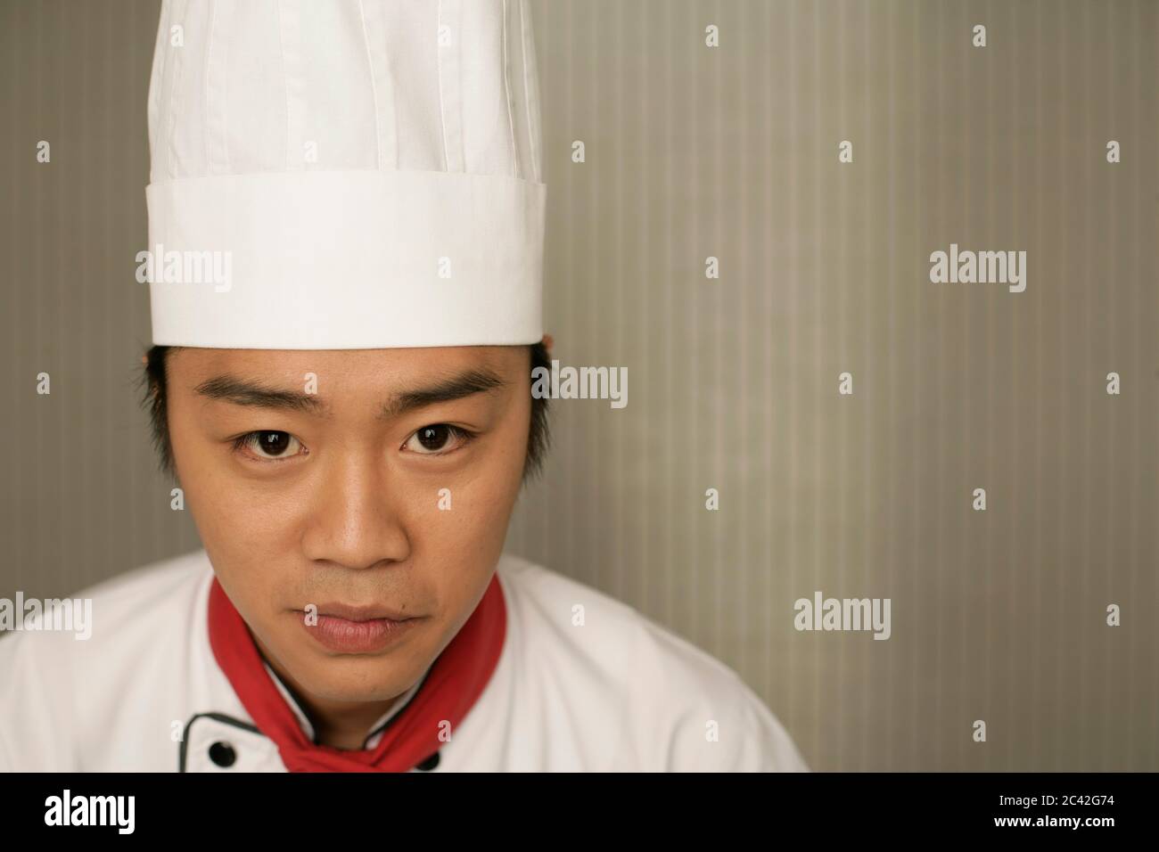 Asian cook with chef hat - restaurant - gastronomy Stock Photo - Alamy