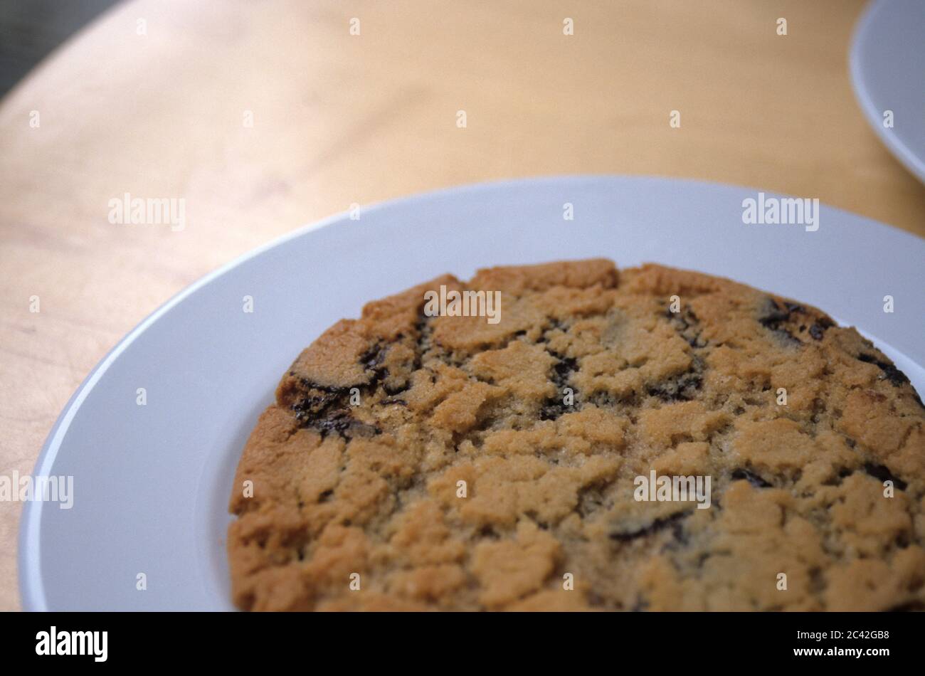 Large biscuit on a plate - candy Stock Photo - Alamy