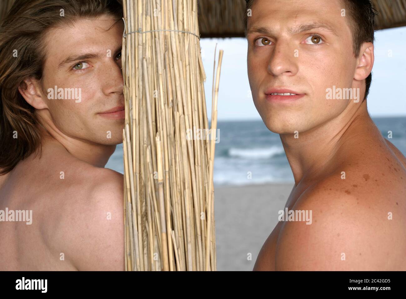 Two men look around Stock Photo - Alamy