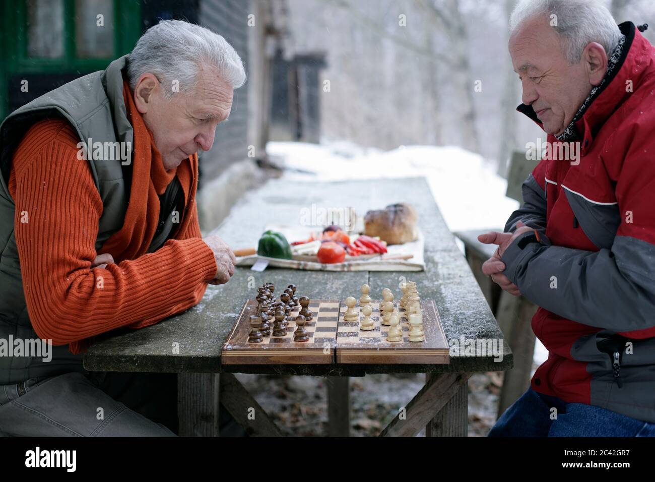 Two old men play chess Stock Photo - Alamy