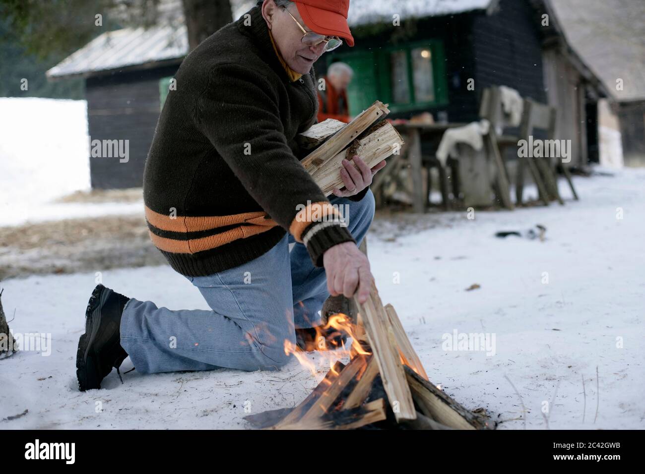 An old man makes a bonfire Stock Photo - Alamy