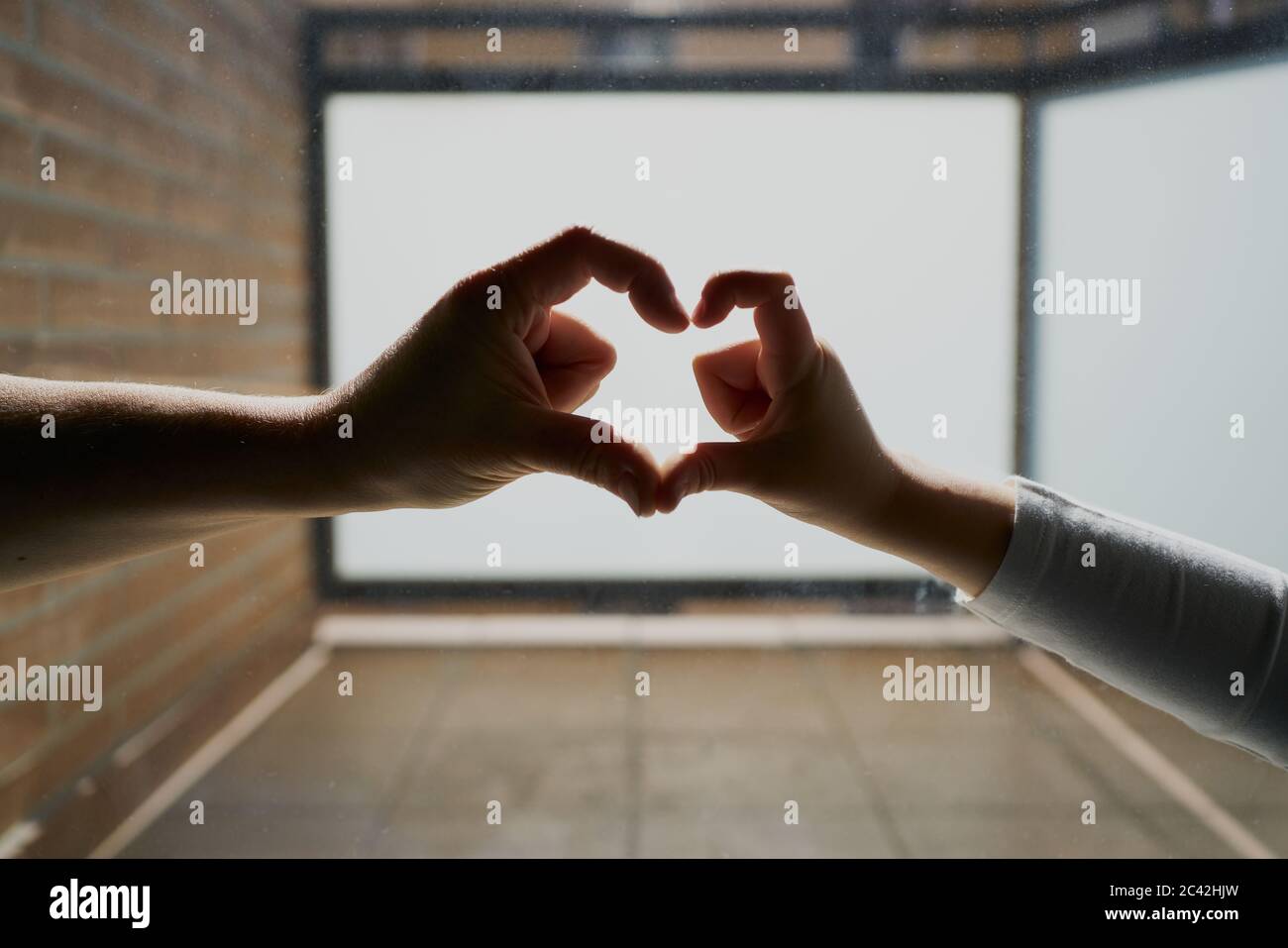 heart shape created by joining two hands Stock Photo - Alamy