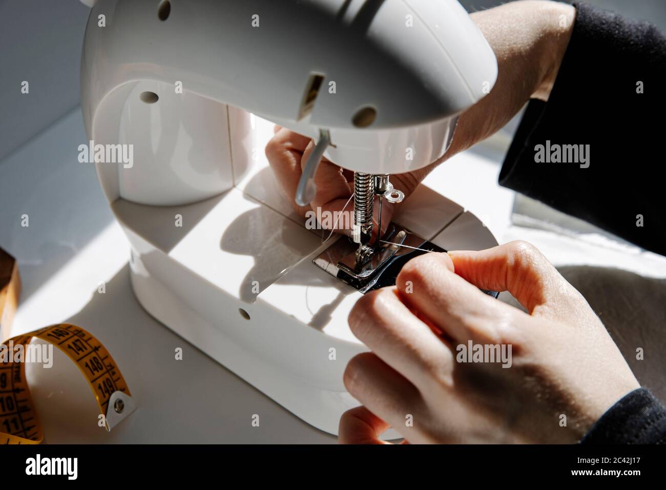 Threading a sewing machine hi-res stock photography and images - Alamy