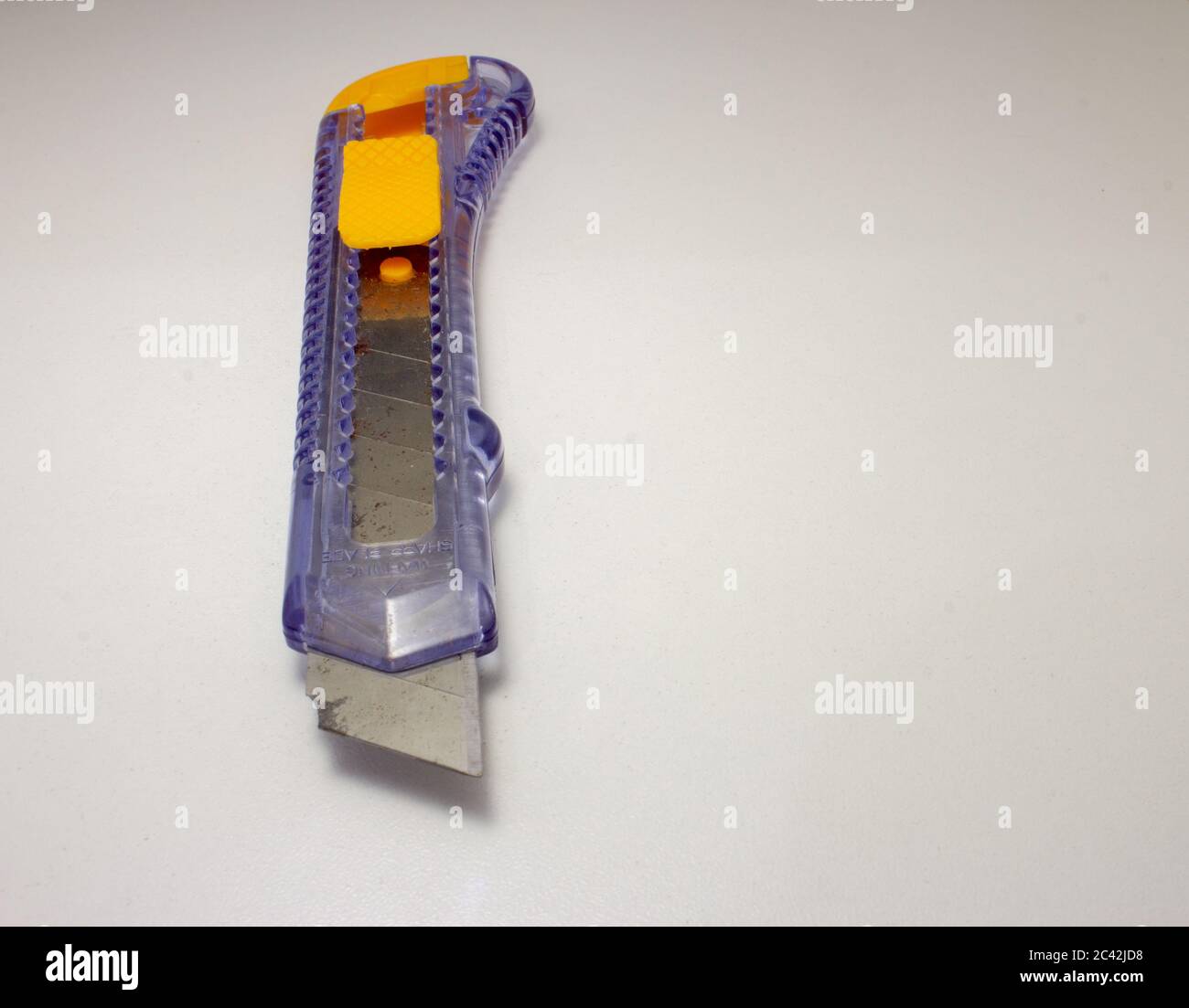 Plastic utility knife with old and rusted blade Stock Photo - Alamy