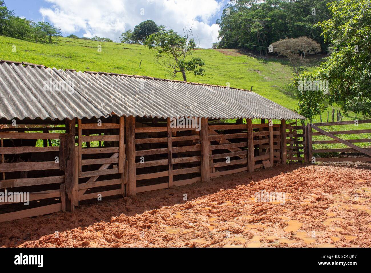 A kind of barn on a corral, after a heavy rain with the ground full of ...