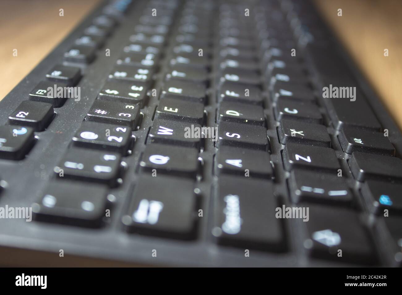 Wireless keyboard computer. Focus on the left side's keys Stock Photo ...