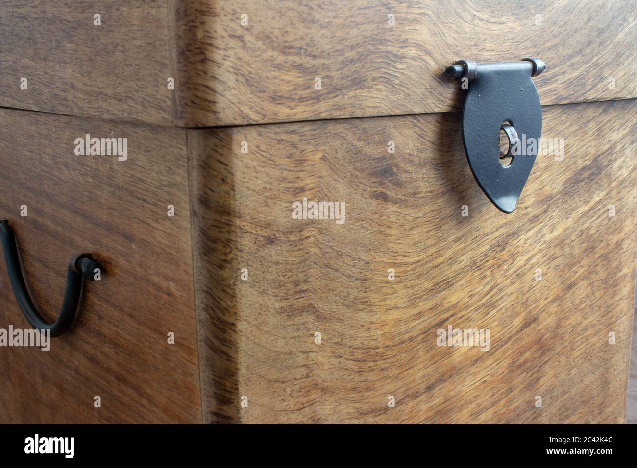 Old wooden locking box showing the lock and the handle Stock Photo - Alamy