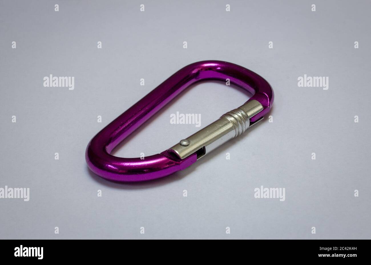 Small purple carabiner used for light loads Stock Photo - Alamy