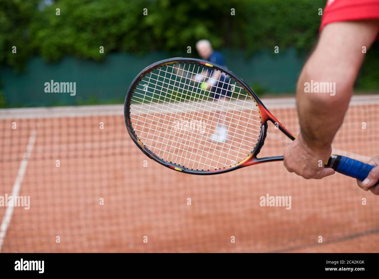 Arm of a tennis player with tennis racket Stock Photo - Alamy