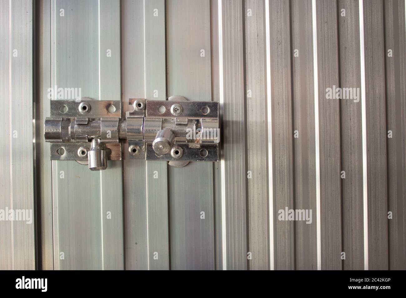 Aluminum latch on an aluminum door frame, brand new and shiny Stock ...