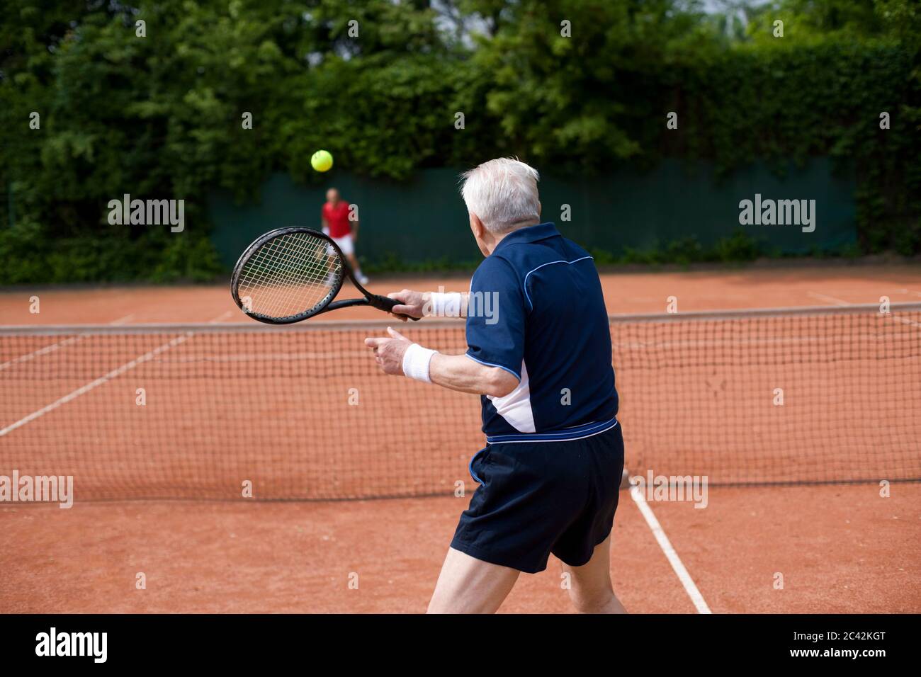 Two older men play tennis Stock Photo - Alamy