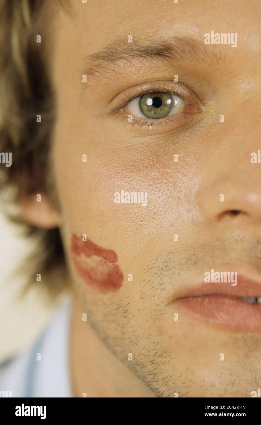 Young man with lipstick imprint - portrait Stock Photo - Alamy